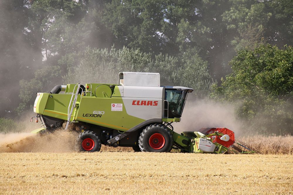 A CLAAS combine harvester working | Free Photo - rawpixel