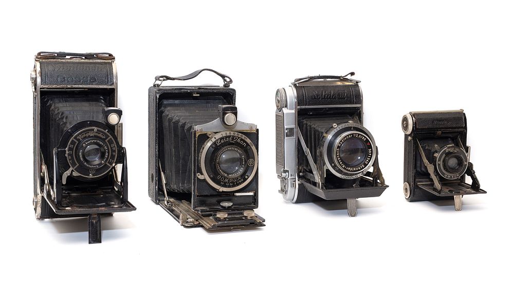 Vintage cameras lined white background | Free Photo - rawpixel