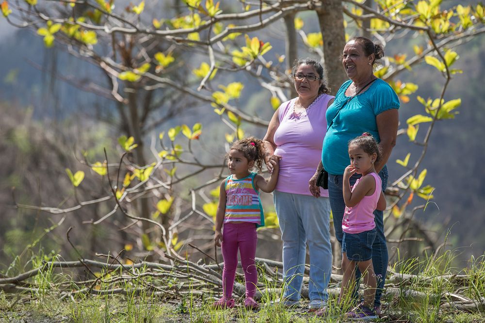 Local residents look on as | Free Photo - rawpixel