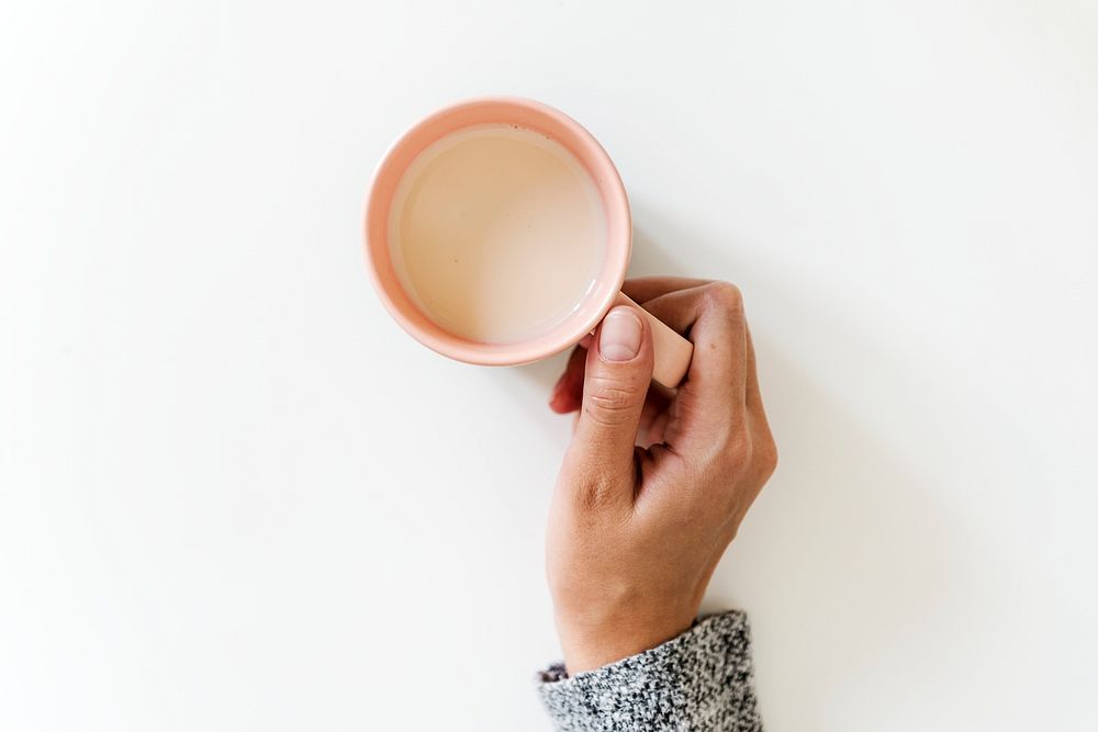 Closeup of hand holding cup | Premium Photo - rawpixel
