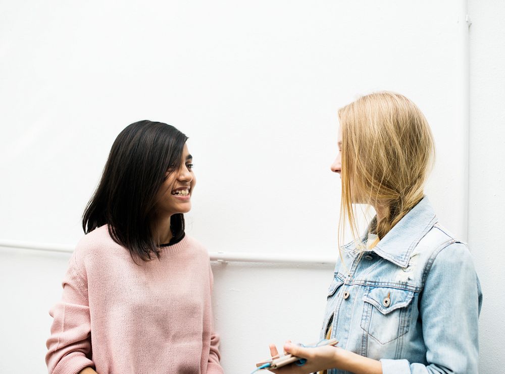 Young girls are talking together | Premium Photo - rawpixel