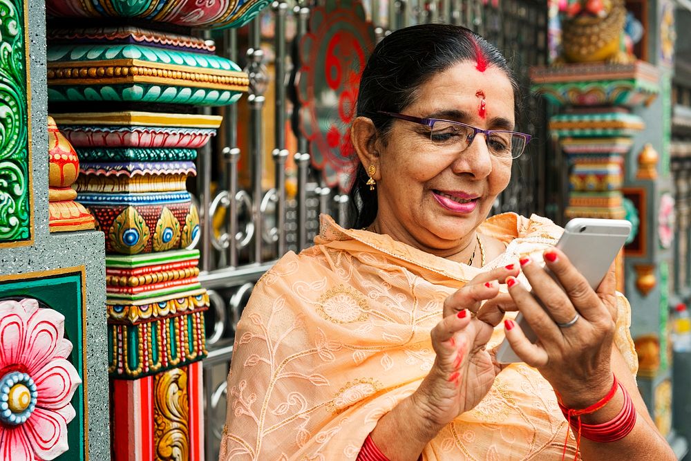 Indian woman using mobile phone | Premium Photo - rawpixel