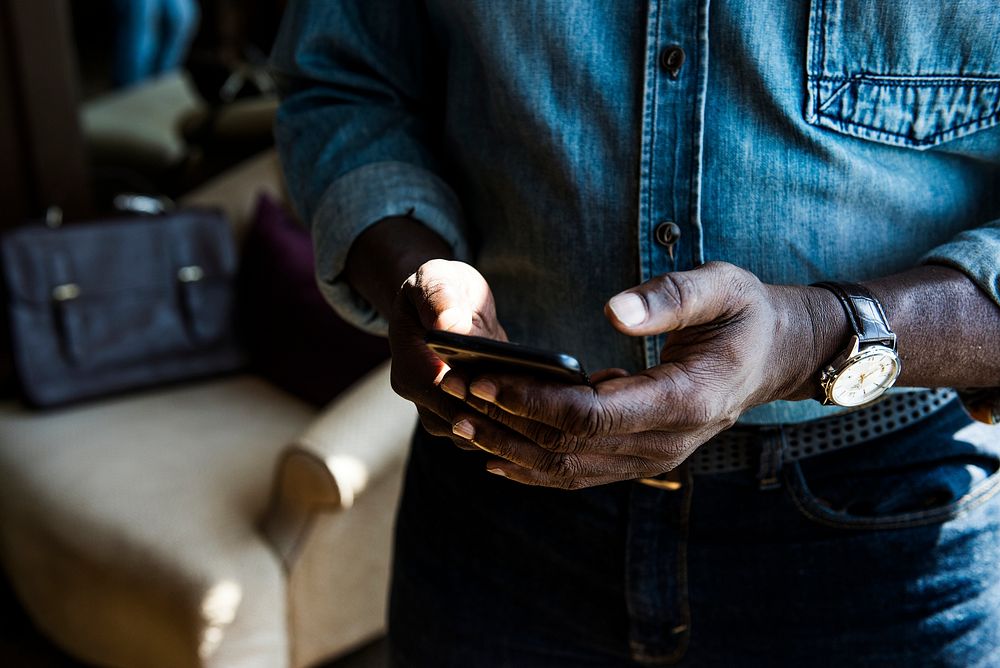 Man working on mobile phone | Premium Photo - rawpixel
