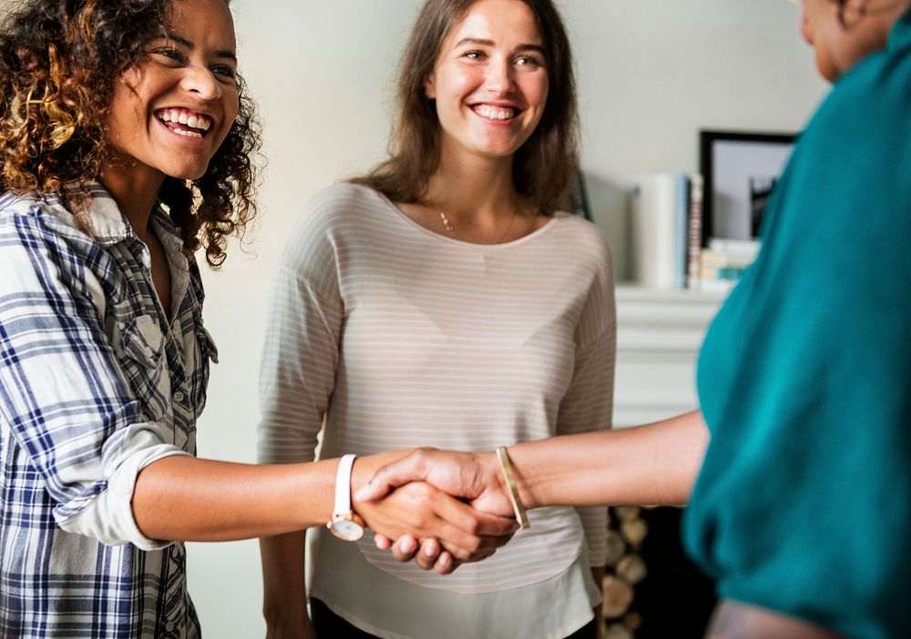 Diverse woman shaking hands | Premium Photo - rawpixel