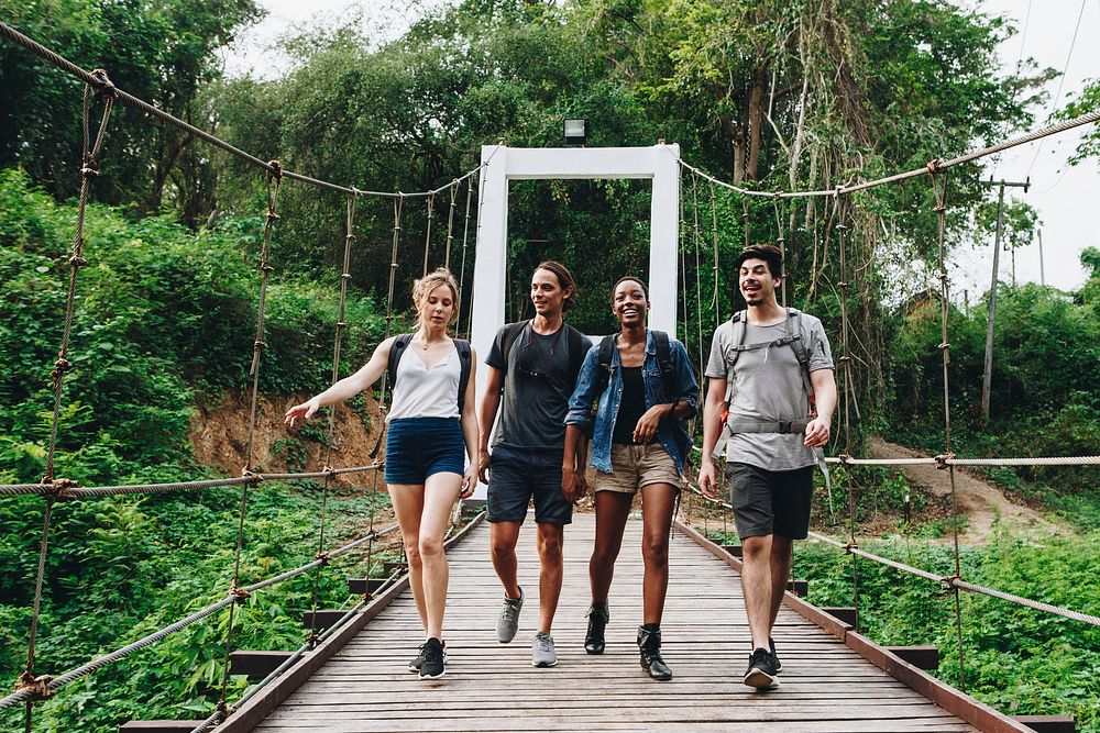 Group of friends walking on the bridge | Photo - rawpixel