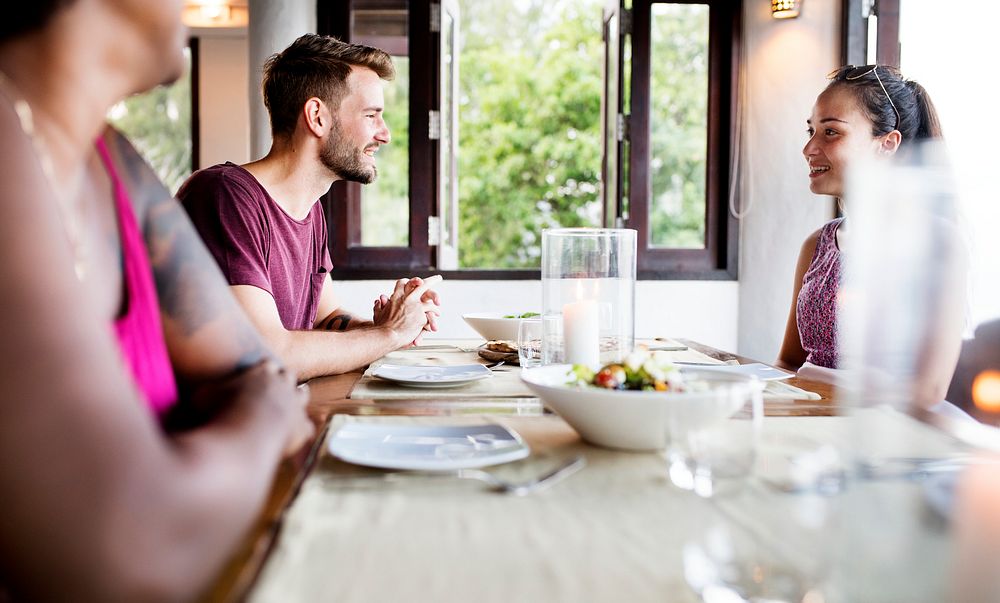 Friends having dinner at a restaurant | Premium Photo - rawpixel