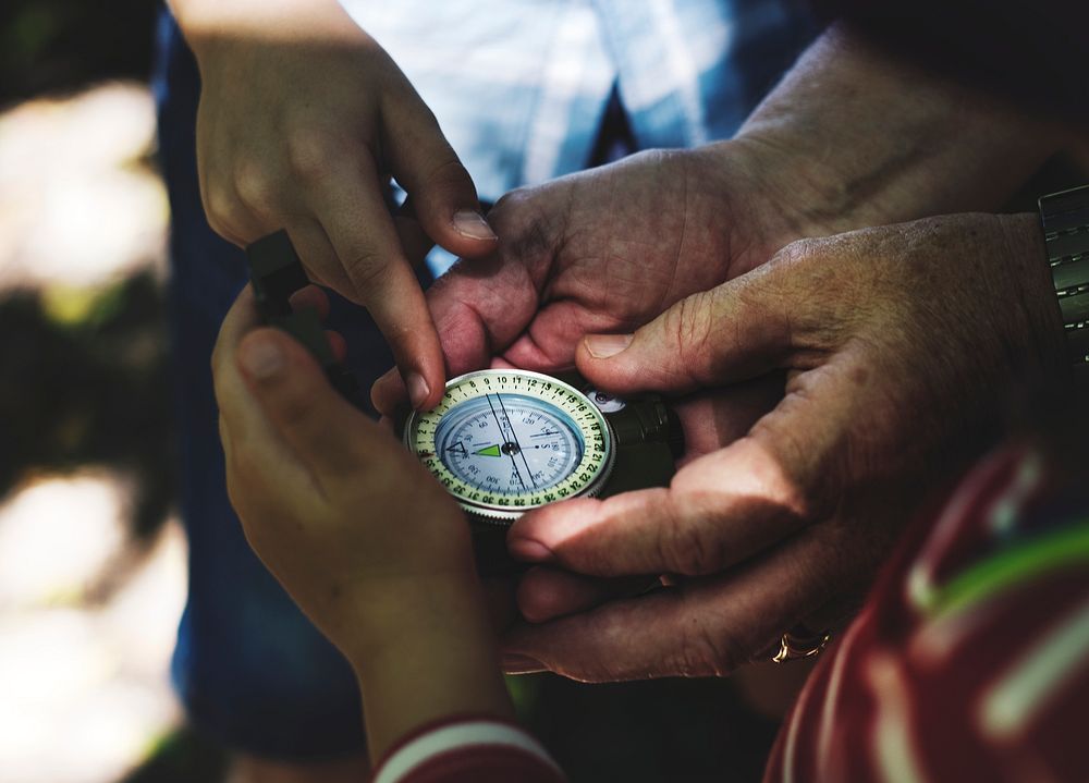 Kids following the directions of a compass | Premium Photo - rawpixel