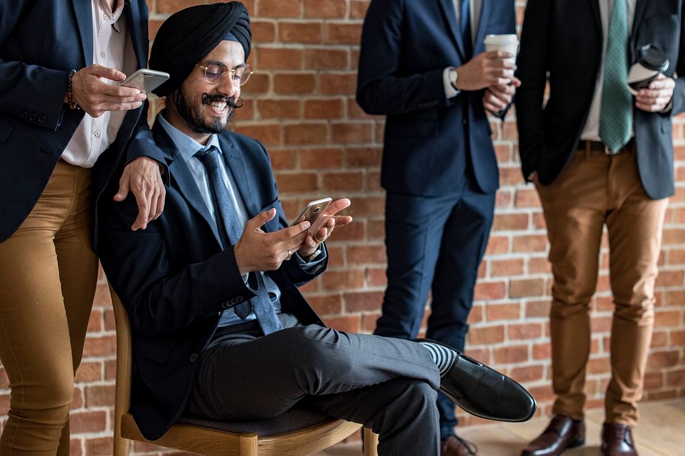 Indian businessman using a smartphone | Premium Photo - rawpixel