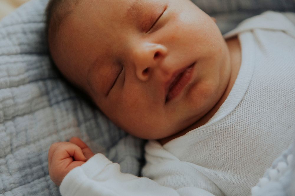 Infant baby fast asleep on the bed | Free Photo - rawpixel