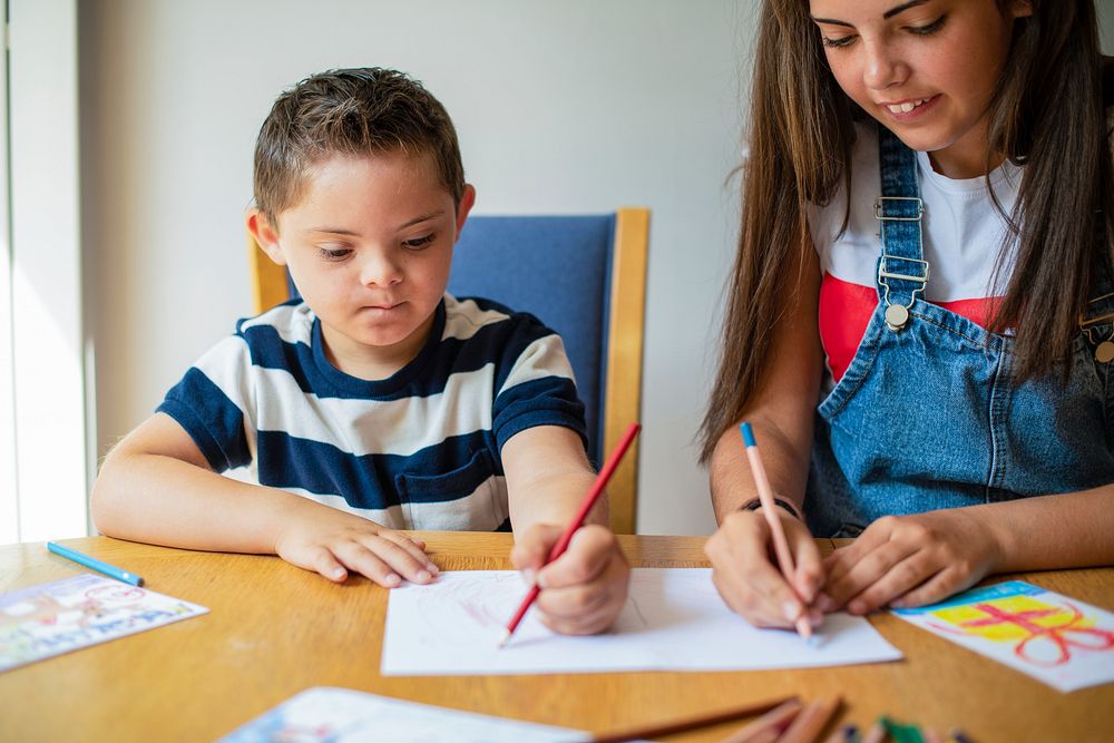 Girl helping her brother to draw | Free Photo - rawpixel