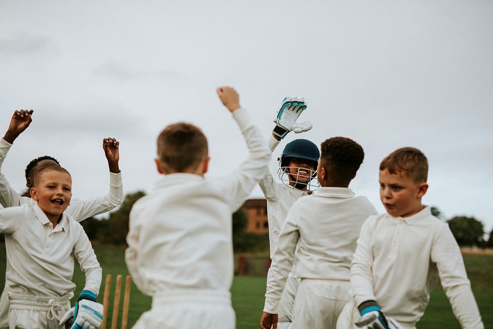 Young cricket players cheering to their | Free Photo - rawpixel