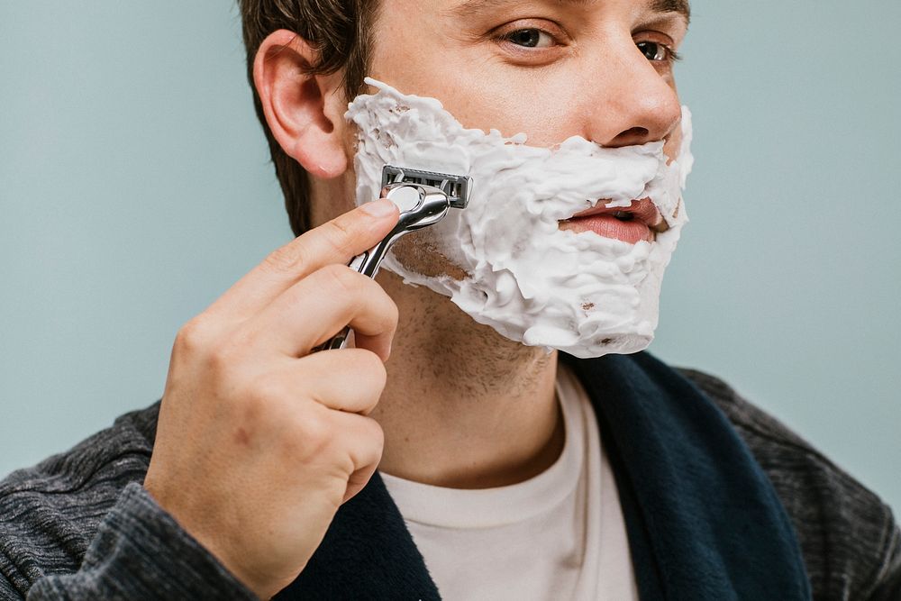 Young man shaving his beard | Premium Photo - rawpixel