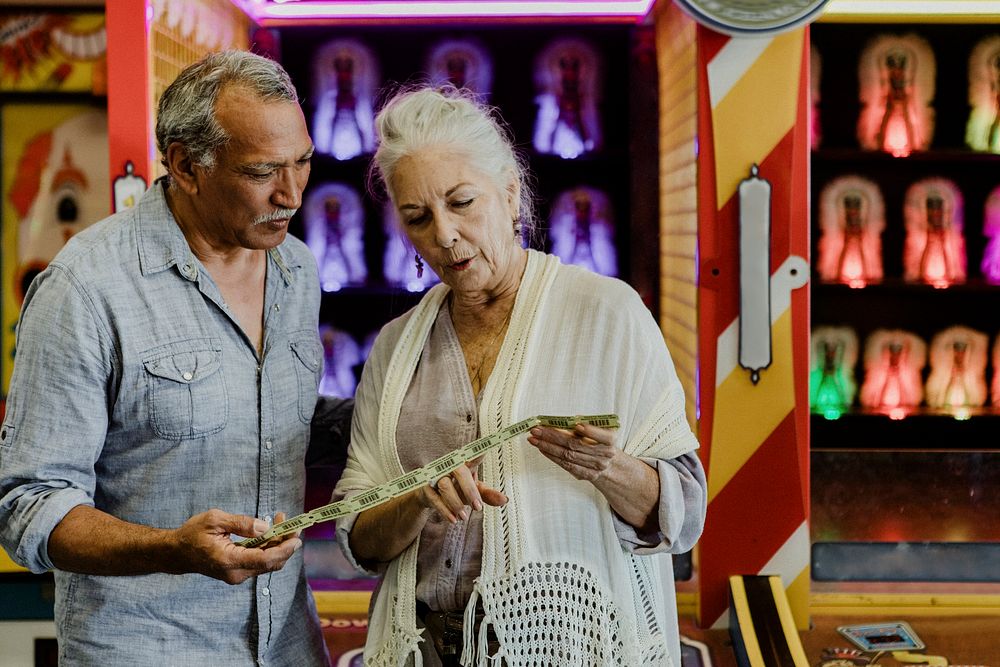 Senior couple looking their raffle | Premium Photo - rawpixel