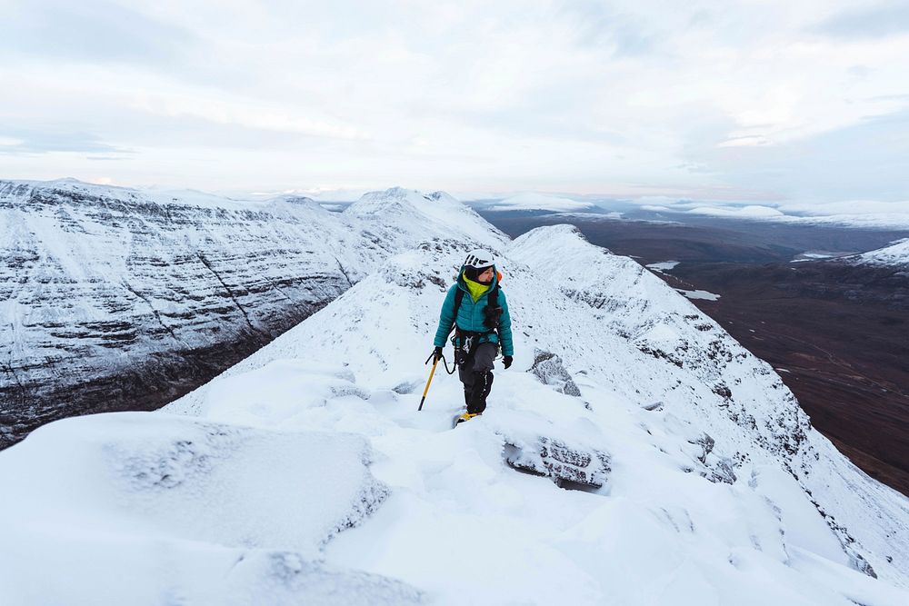 Mountaineer climbing snow Liathach Ridge, | Premium Photo - rawpixel