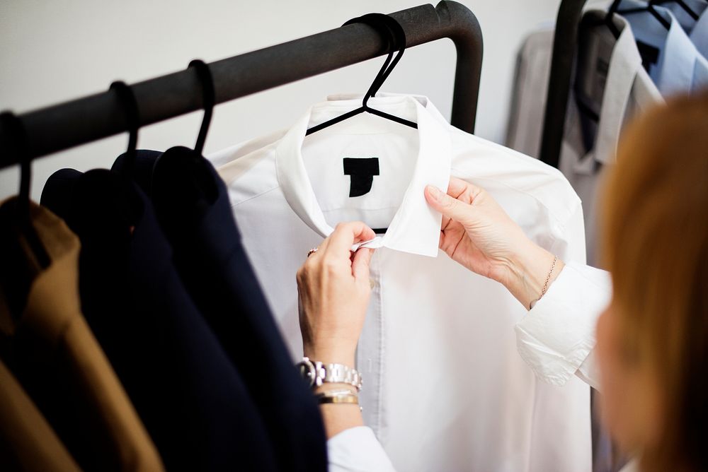 A stylist is choosing cloth | Premium Photo - rawpixel