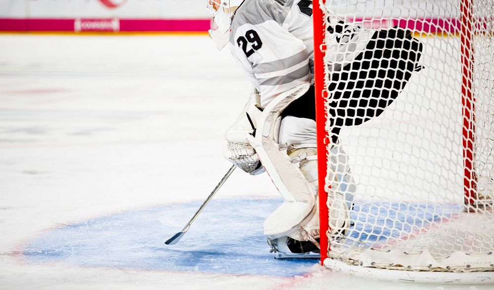 Goaltender guarding the goal crease | Free Photo - rawpixel