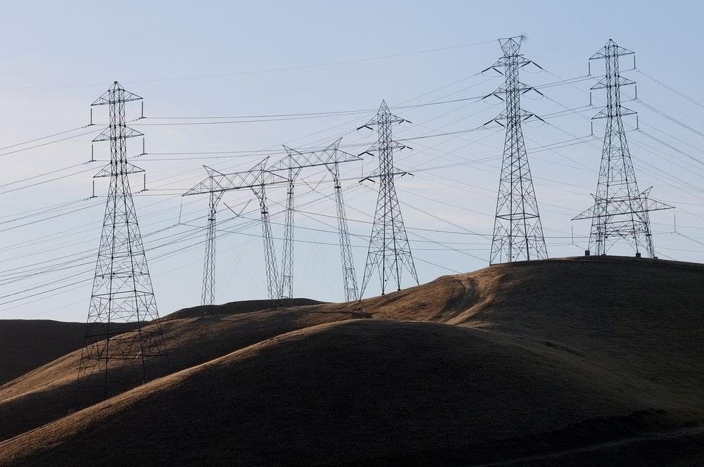 Utility towers yellow hill sky | Free Photo - rawpixel