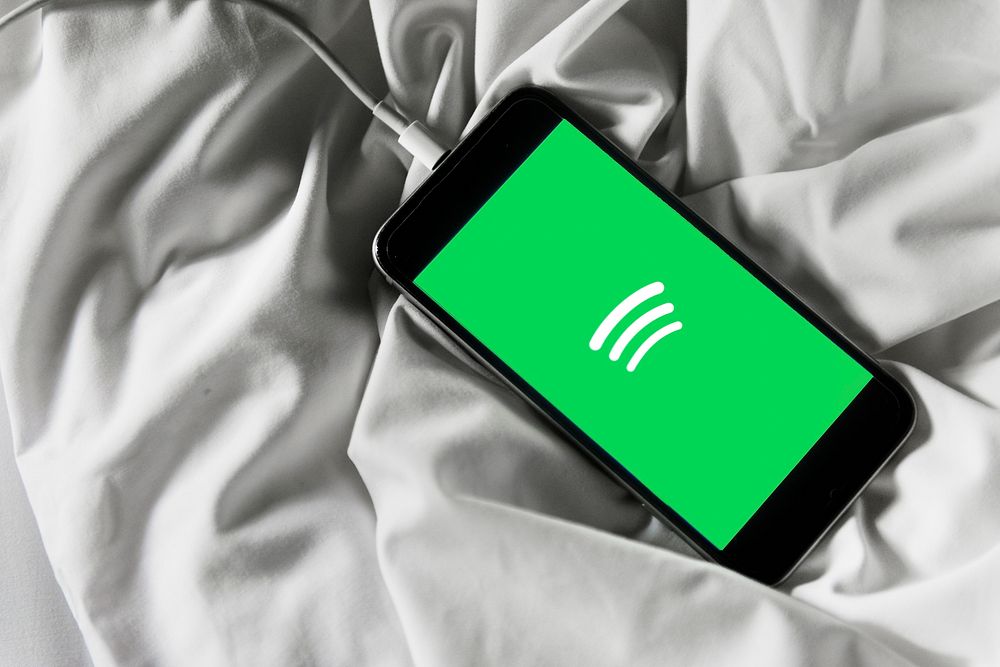Spotify logo showing on a phone | Free Photo - rawpixel