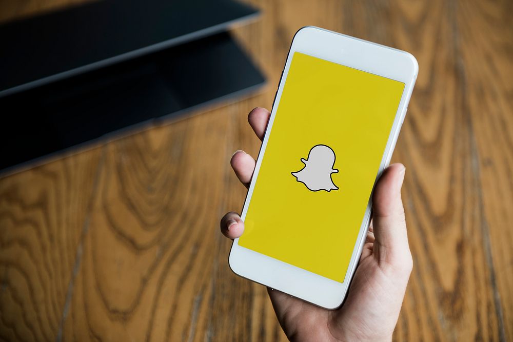 person using Snapchat phone. BANGKOK, | Free Photo - rawpixel