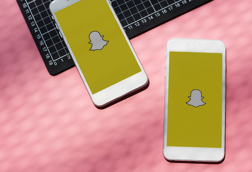 Snapchat logo showing phones. BANGKOK | Free Photo - rawpixel