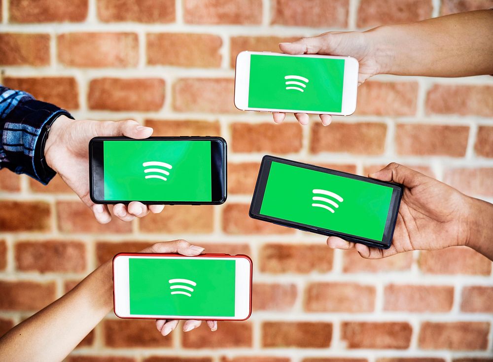 People using Spotify applications phones. | Free Photo - rawpixel
