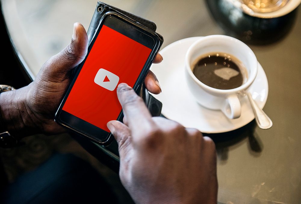A person using Youtube application | Free Photo - rawpixel