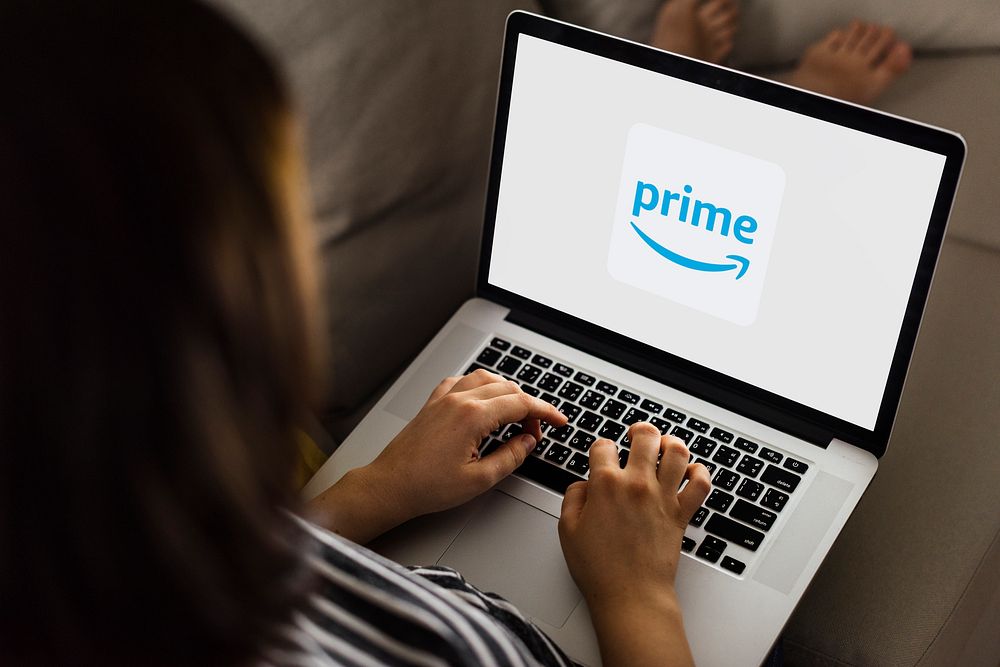 Woman watching Prime Video on a laptop | Free Photo - rawpixel