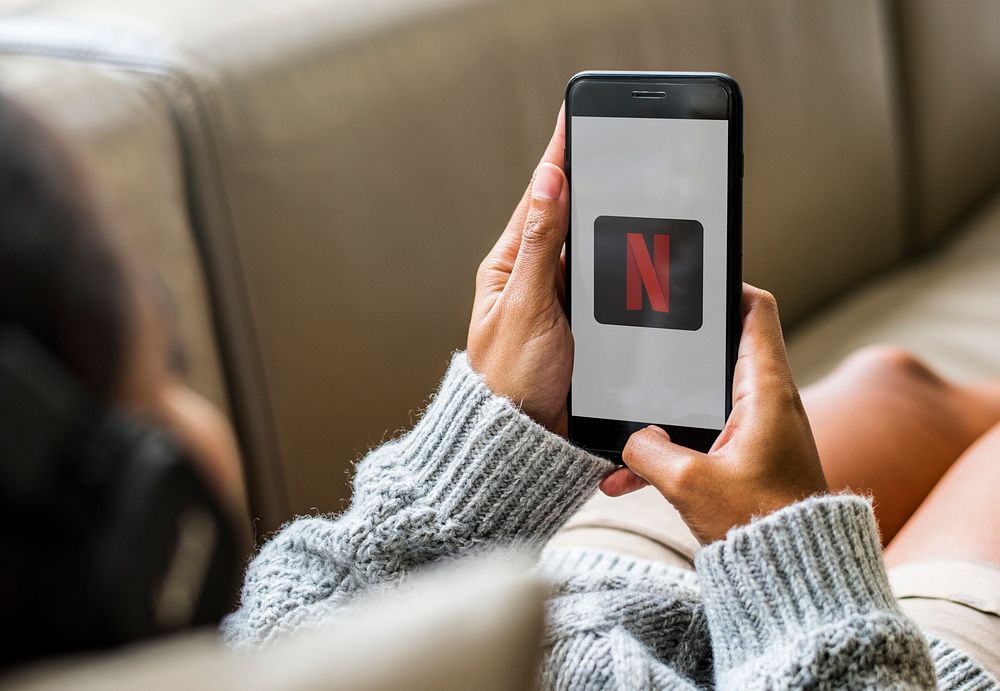 Woman watching Netflix phone. BANGKOK, | Free Photo - rawpixel