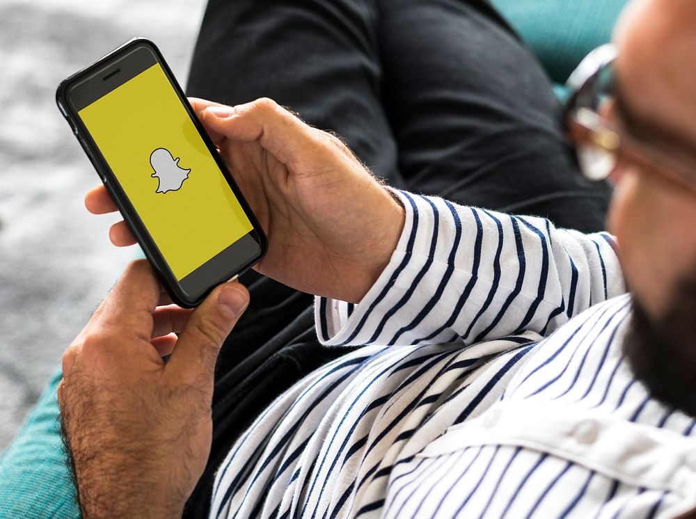 Snapchat logo showing mobile phone. | Free Photo - rawpixel