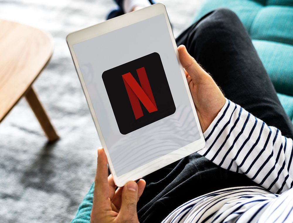 Person watching Netflix tablet. BANGKOK, | Free Photo - rawpixel