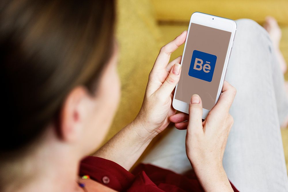 Woman using Behance application phone | Premium Photo - rawpixel