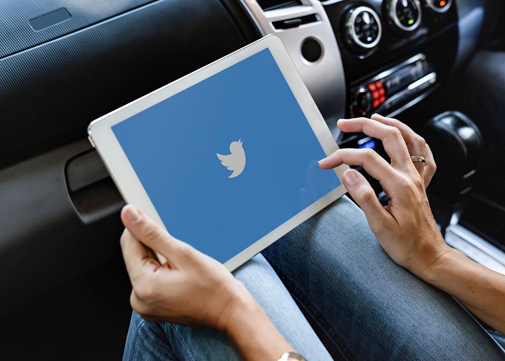 Woman using Twitter application digital | Free Photo - rawpixel