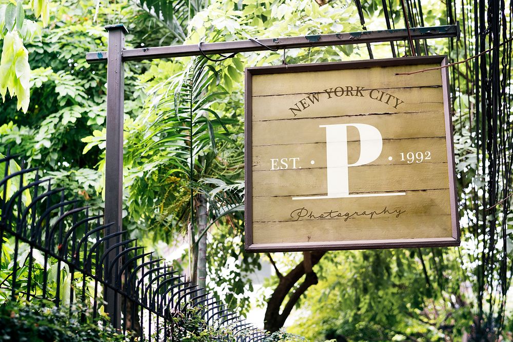 Wooden signboard at a gate | Photo - rawpixel