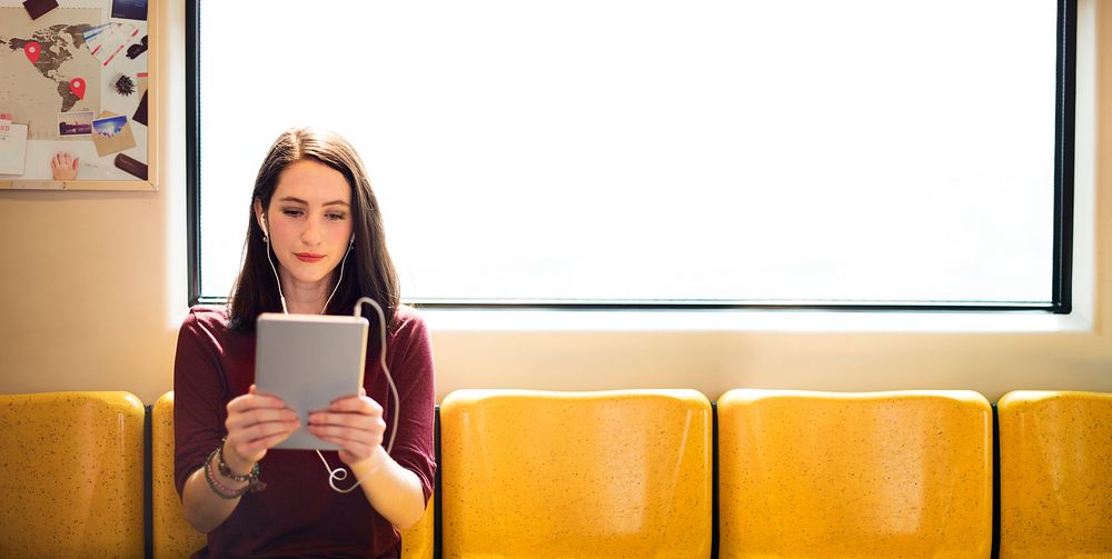 Girl using digital tablet subway | Premium Photo - rawpixel