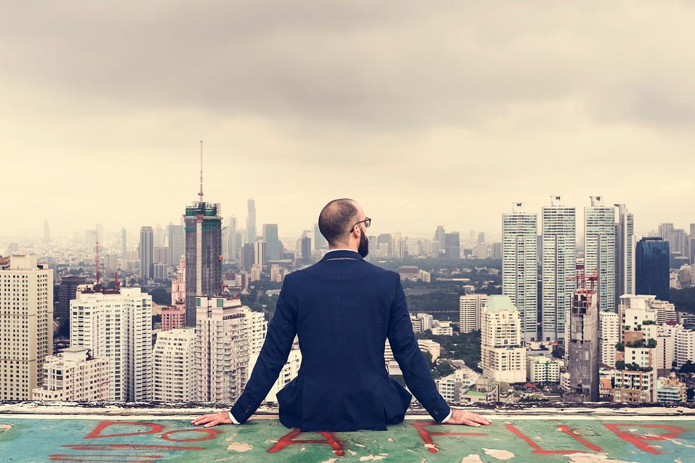 Business Person Sitting Rooftop Concept | Premium Photo - rawpixel