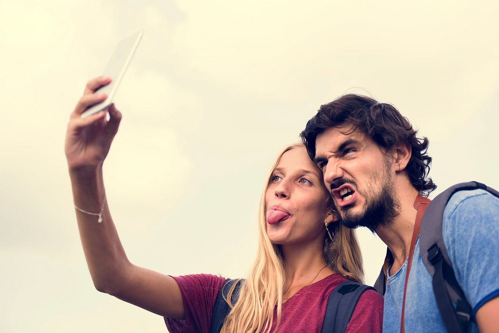 Couple taking a wacky selfie | Premium Photo - rawpixel