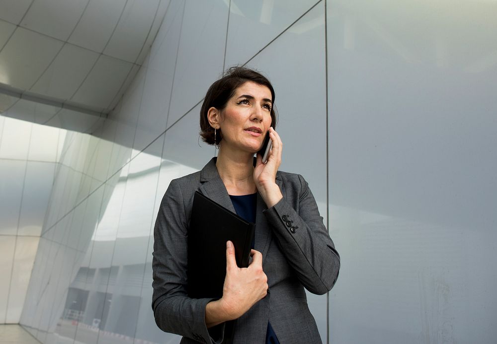 Businesswoman Talking Using Phone Working | Premium Photo - rawpixel