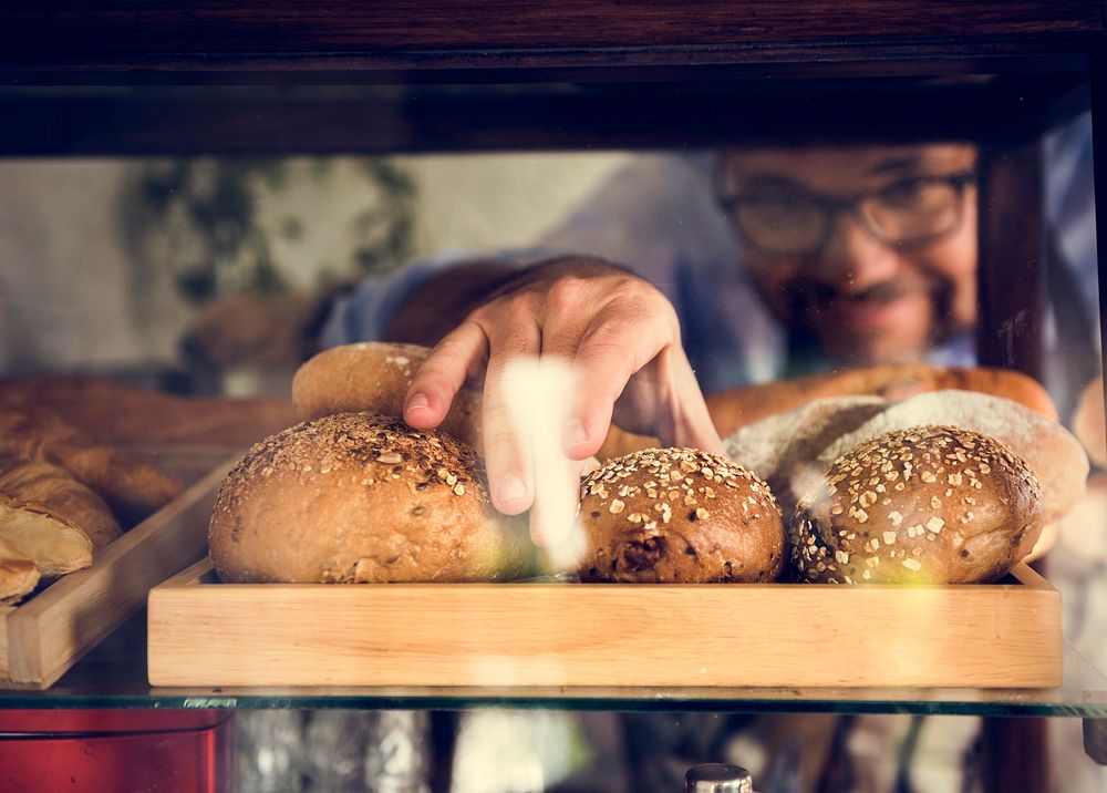 Man Hand Picking Baked Bread | Premium Photo - rawpixel