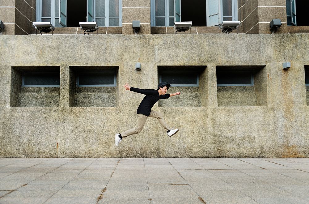 Asian Guy Jumping Cheerful Street | Premium Photo - rawpixel
