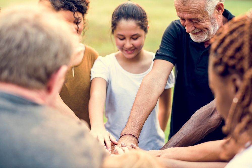 Group of people holding hand | Photo - rawpixel