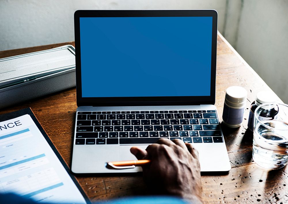Laptop on a desk with blue | Premium Photo - rawpixel