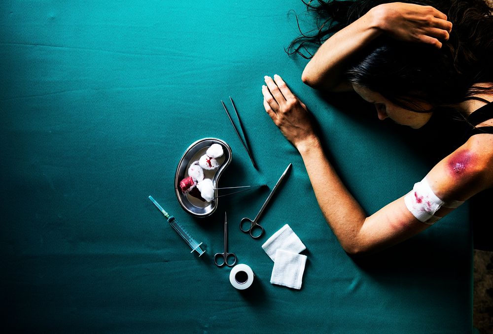 Physically hurt woman being treated | Premium Photo - rawpixel