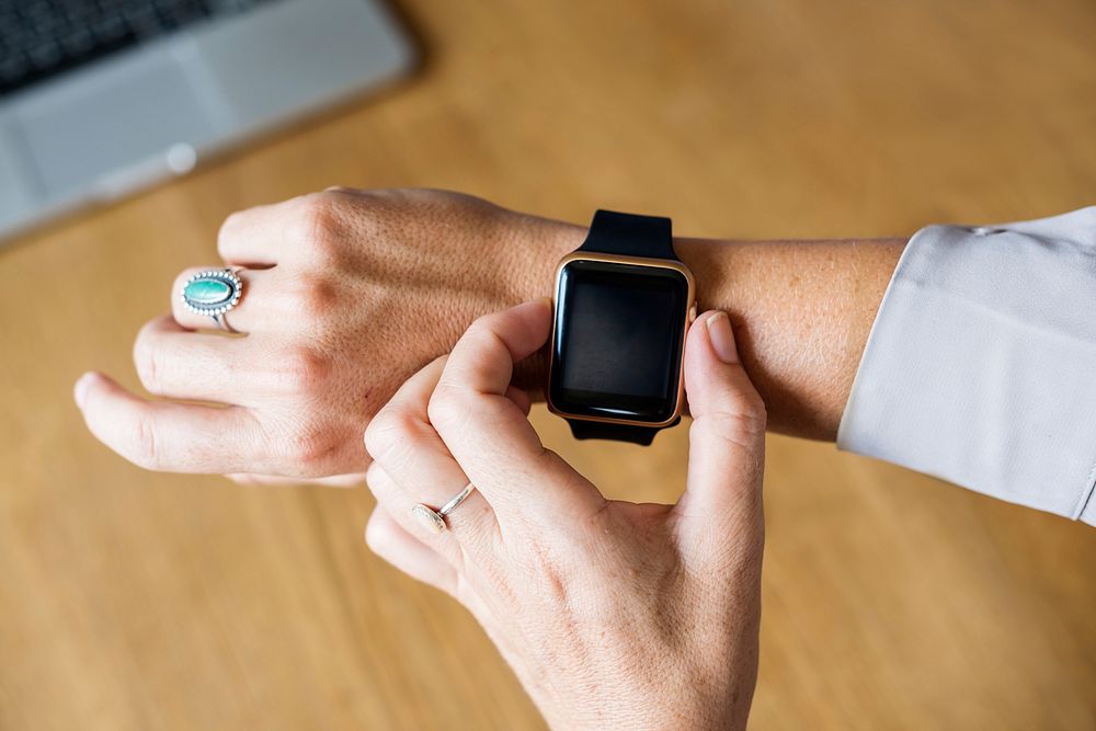 Hand setting smartwatch another hand | Premium Photo - rawpixel