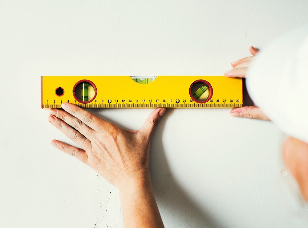 Repairman working measuring ruller wall | Premium Photo - rawpixel
