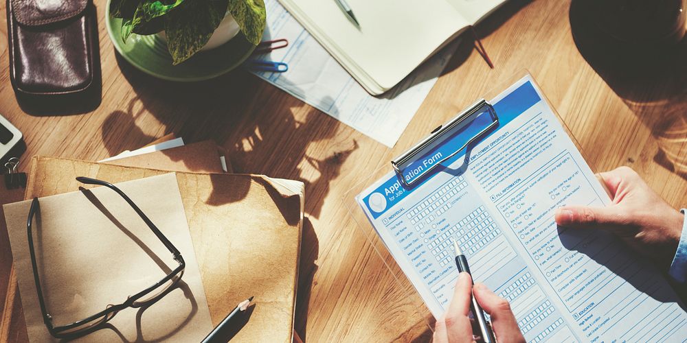 Businessman Filling Form Office Desk | Premium Photo - rawpixel