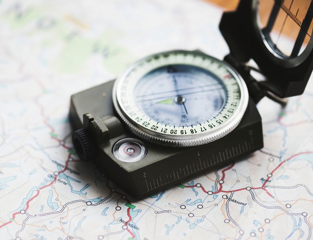 Closeup of compass on the map | Free Photo - rawpixel