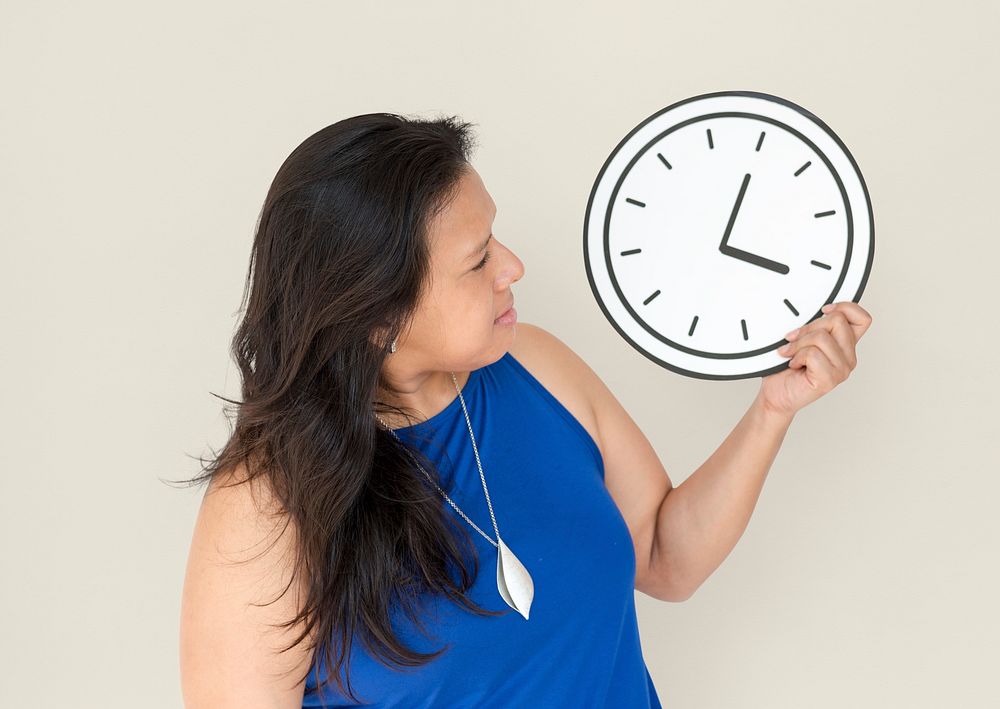 Woman checking the time on the clock | Premium Photo - rawpixel
