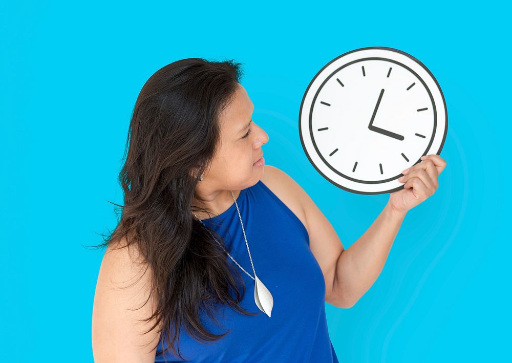Woman checking the time on the clock | Premium Photo - rawpixel