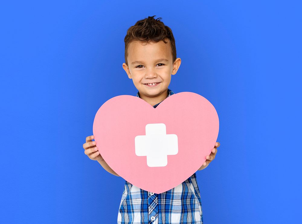Boy holding a heart with a white | Premium Photo - rawpixel