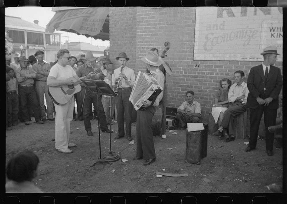 Orchestra playing outside grocery store | Free Photo - rawpixel